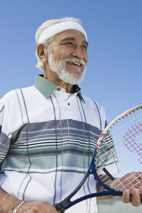 Senior Man Holding Tennis Racket Stock Image - Image of person, hobbies ...