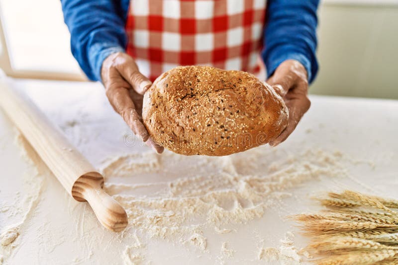 Senior Man Holding Wholemeal Bread at Kitchen Stock Image - Image of ...