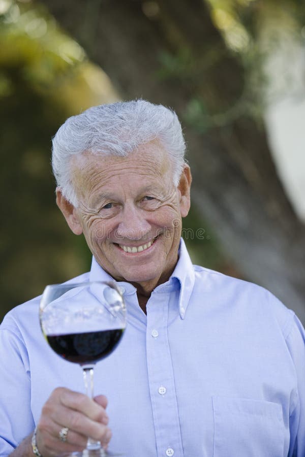 Senior Man Holding Wine Glass Stock Image - Image of person, occasion ...