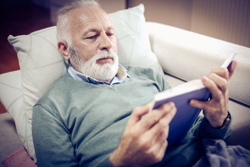 Resting and reading book. stock image. Image of older - 119964649