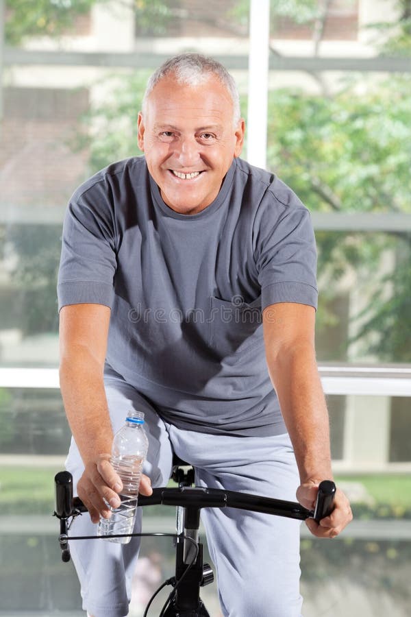 Senior Man on Home Trainer in Gym Stock Image - Image of center ...