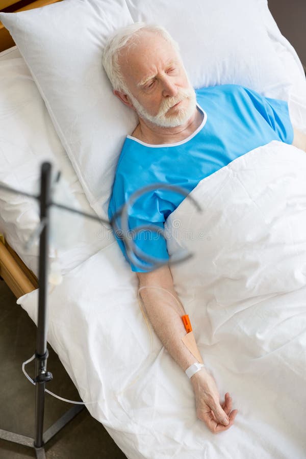 Senior man in hospital bed stock photo. Image of european - 93020714