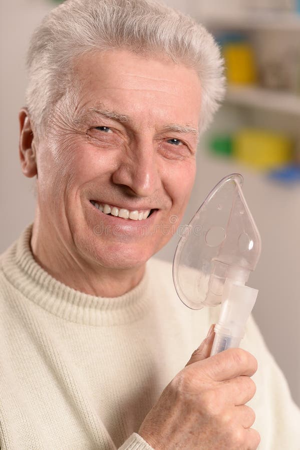 Senior man with inhaler stock image. Image of portrait - 102410439
