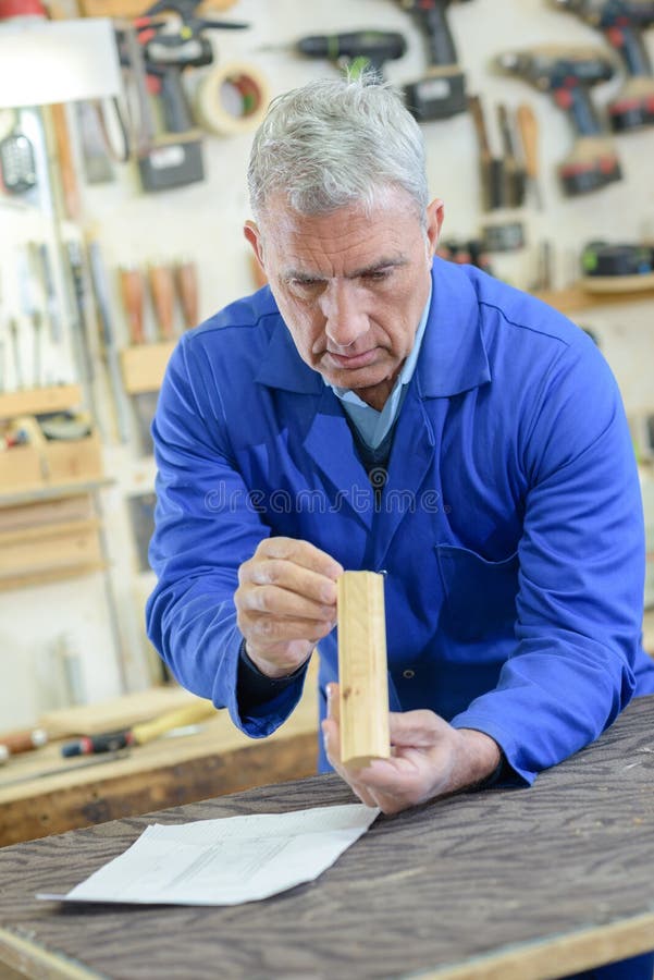 Senior Man Inspecting Lintel on Construction Site Stock Photo - Image ...