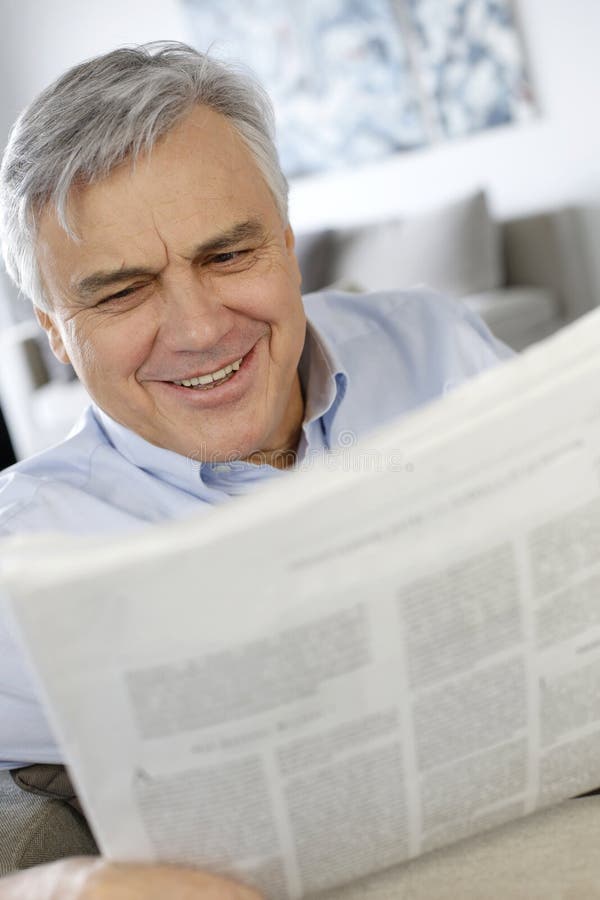 Senior Man Laughing Reading Newspaper Stock Image - Image of serenity ...