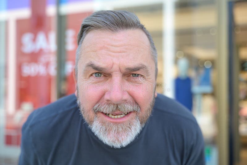 Senior Man Leaning Forwards Staring into the Camera Stock Image - Image ...