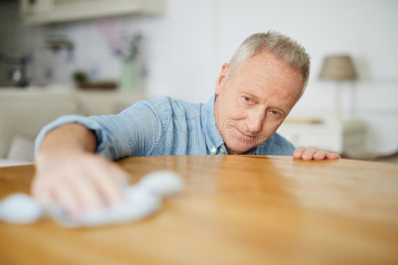 Man doing housework stock photo. Image of grandparent - 119078142