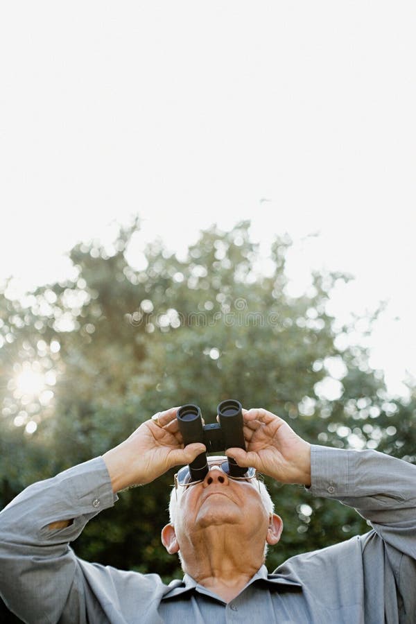 Senior Man Looking through Binoculars Stock Image - Image of outdoors ...