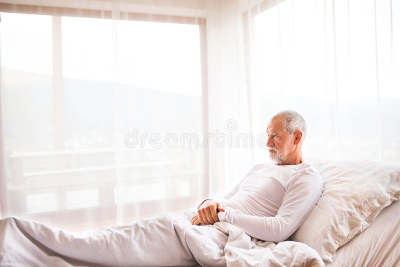 Senior Man Lying in Bed at Home. Stock Image - Image of comfort ...