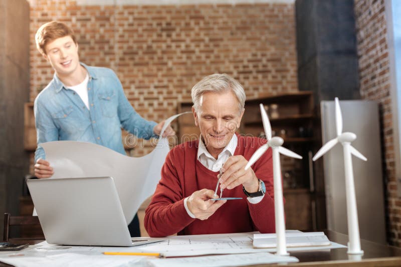 Senior Man Measuring Distance on Protractor with Compass Stock Photo ...