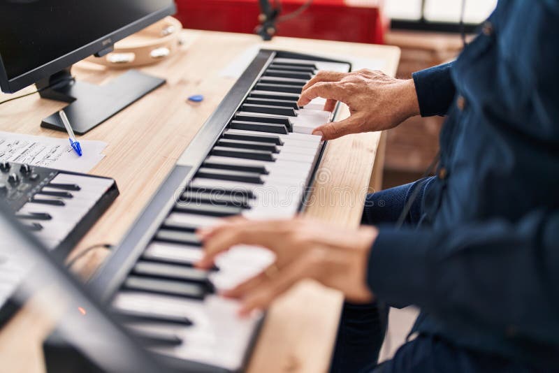 Senior Man Musician Playing Piano Keyboard at Music Studio Stock Photo ...