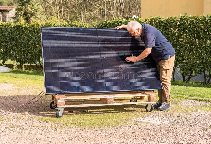 Senior Man with Photovoltaic Solar Panel in the Garden Stock Image ...
