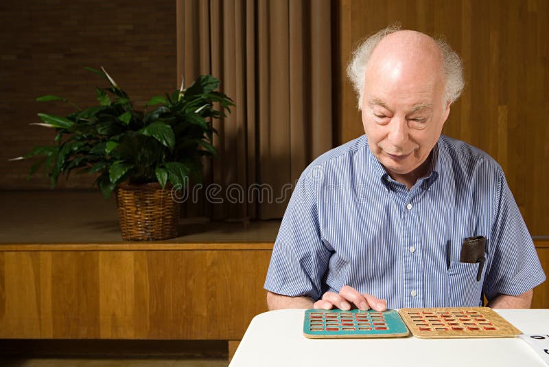 Senior man playing bingo stock photo. Image of home, center - 62809334