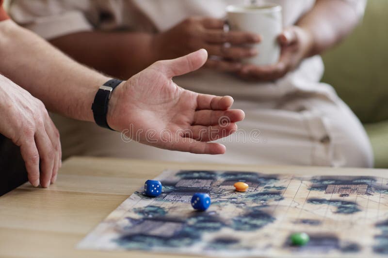 Senior Man Playing Board Game with Hand Throwing Dice on Table Stock ...