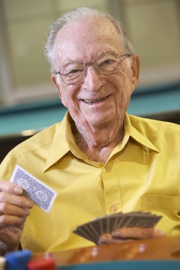 Senior man playing bridge stock photo. Image of sitting - 9003854