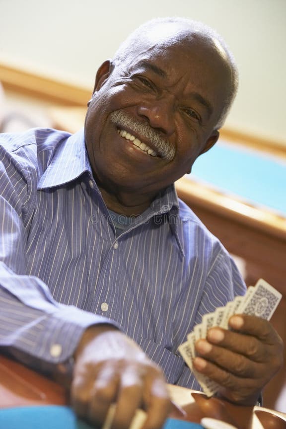 Senior man playing bridge stock photo. Image of adult - 9003856
