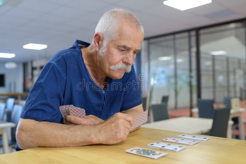 Senior Man Playing Cards Alone Stock Image - Image of alone, playing ...