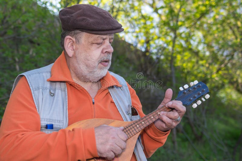 Senior Man Playing Mandolin Stock Photo - Image of adult, hill: 148211234