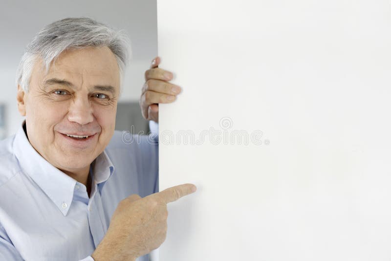 Senior Man Pointing on White Wall Stock Photo - Image of handsome ...