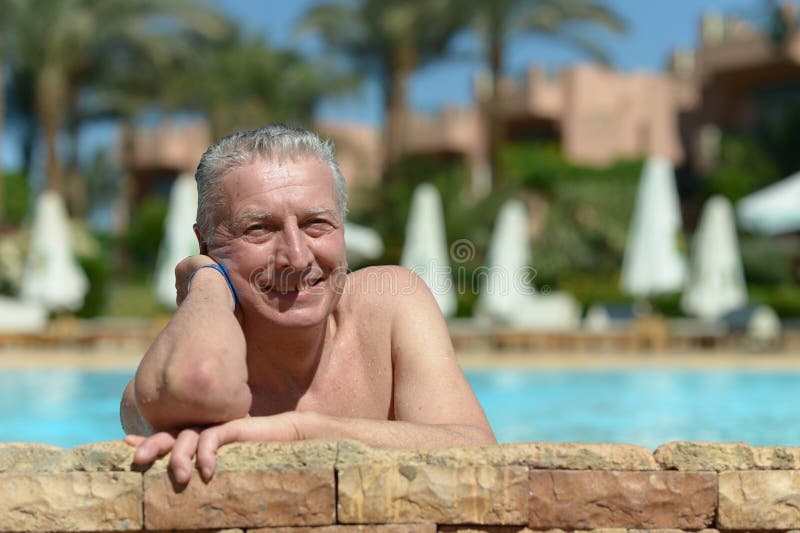 Senior man in pool stock photo. Image of rest, people - 40392446