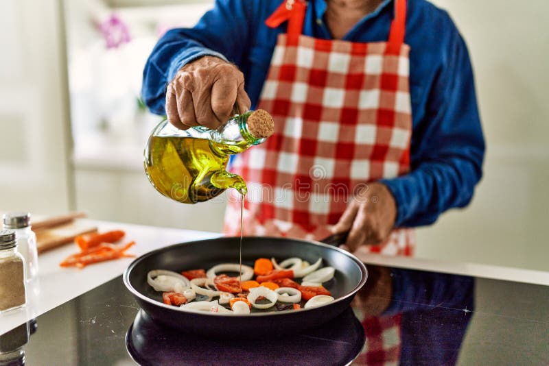 Senior Man Pouring Oil on Frying Pan at Kitchen Stock Photo - Image of ...
