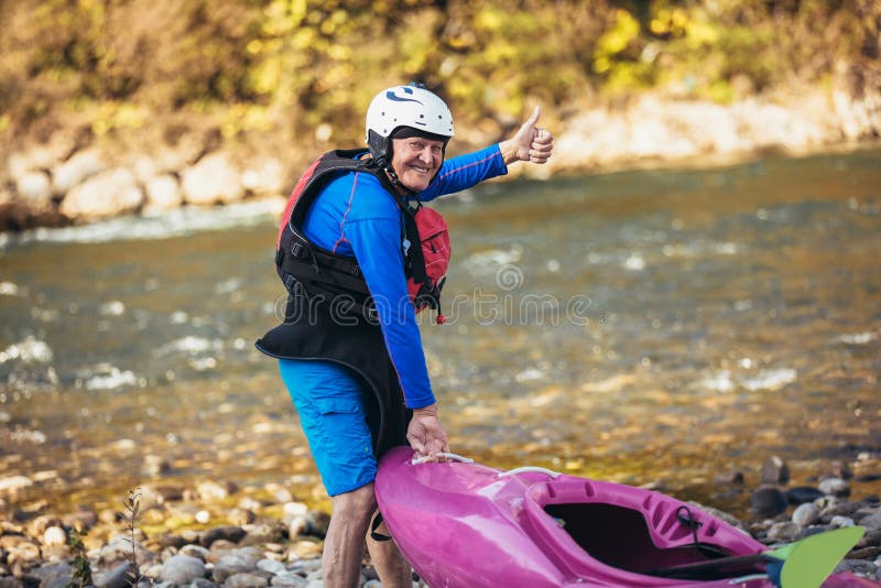 Senior Man Preparing for Kayak Tour on a Mountain River Stock Image ...