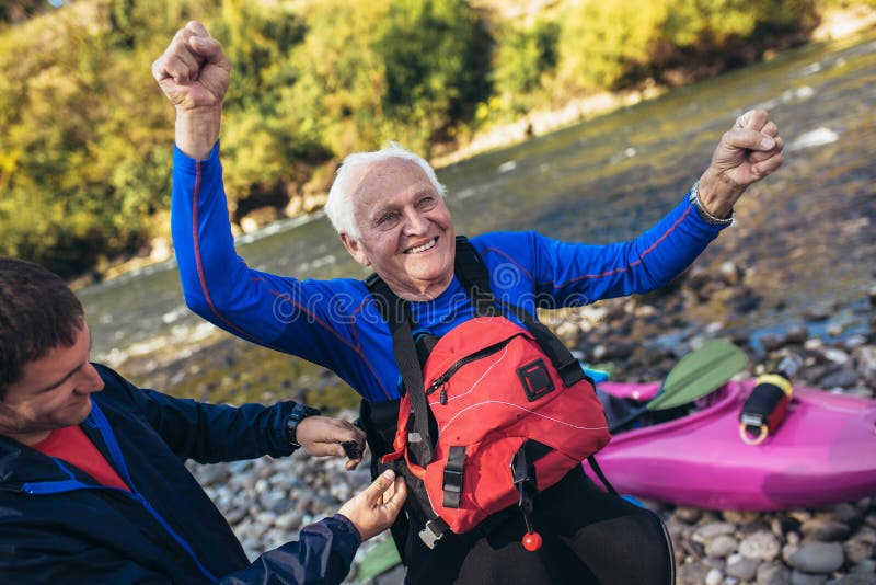 Senior Man Preparing for Kayak Tour on a Mountain River Stock Image ...
