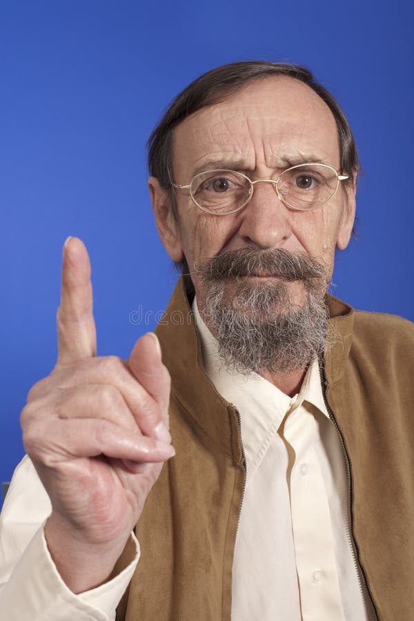 Senior man raising finger stock photo. Image of senior - 23497030