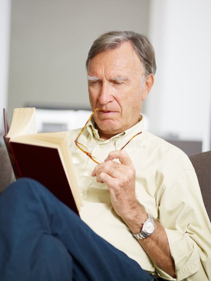 Senior man reading book stock image. Image of domestic - 11283693