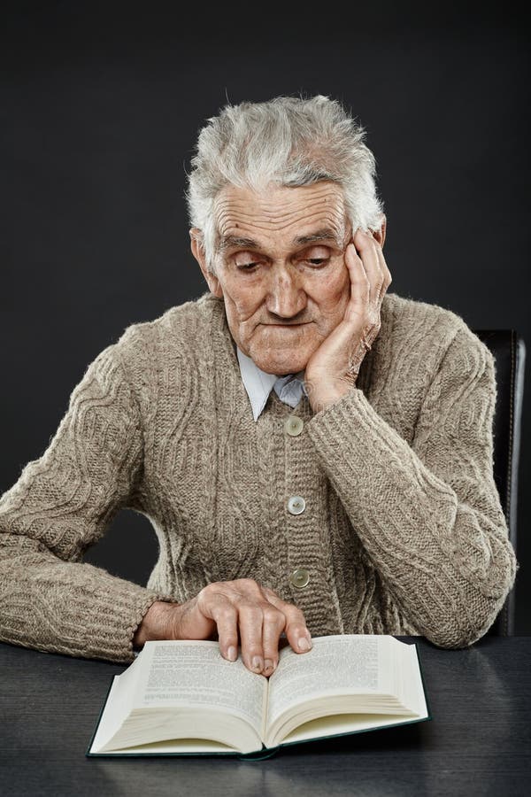 Senior man reading a book stock photo. Image of isolated - 52411734