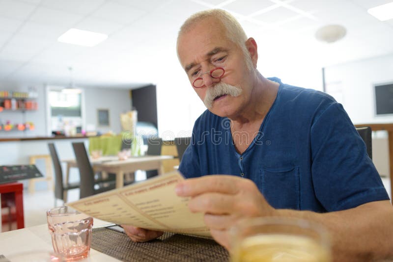 Senior Man Reading Menu in Restaurant Stock Image - Image of male ...