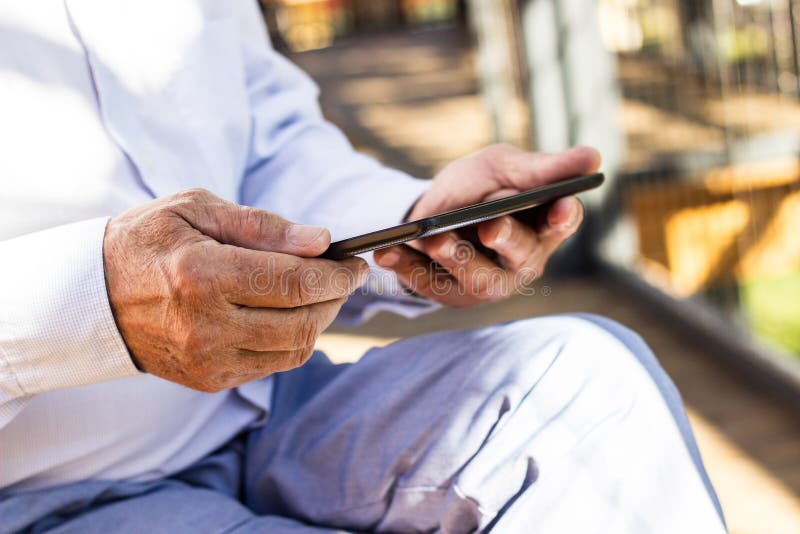 Senior Man Reading News on Digital Tablet Stock Photo - Image of laptop ...