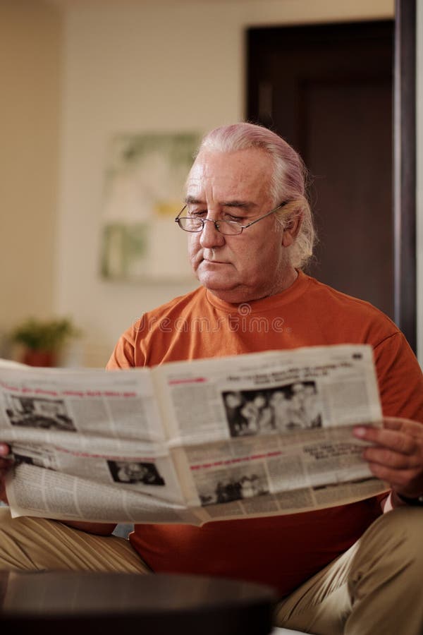 Senior Man Reading Newspaper Stock Photo - Image of smiling, sitting ...