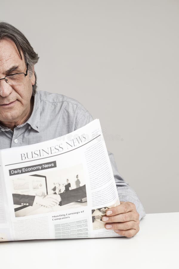 Senior Man Reading Newspaper on Table Stock Image - Image of publishing ...