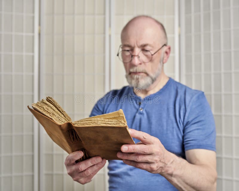 Senior Man is Reading an Old Book Stock Image - Image of reading ...