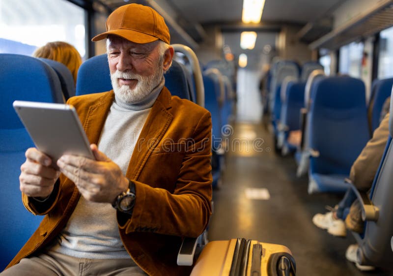 Senior Man Reading on Tablet in Train Stock Photo - Image of enjoying ...