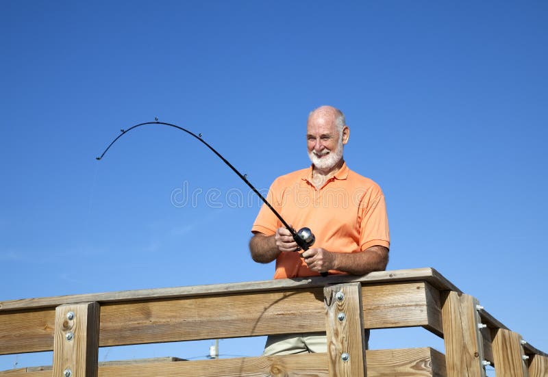 Senior Man Reels in Fish stock photo. Image of people - 11670750