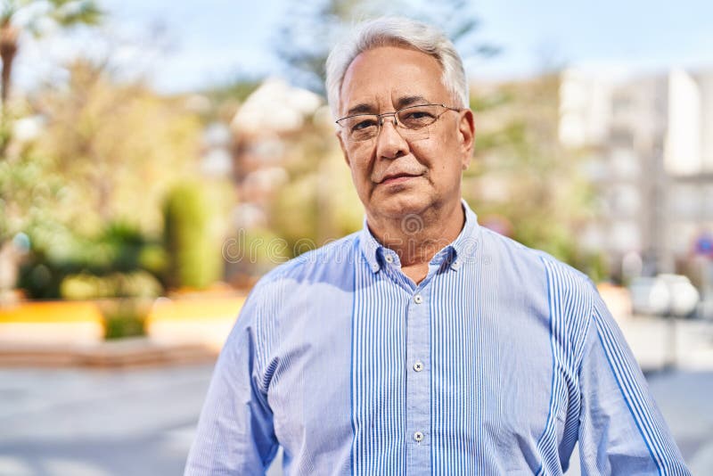 Senior Man with Relaxed Expression Standing at Park Stock Image - Image ...