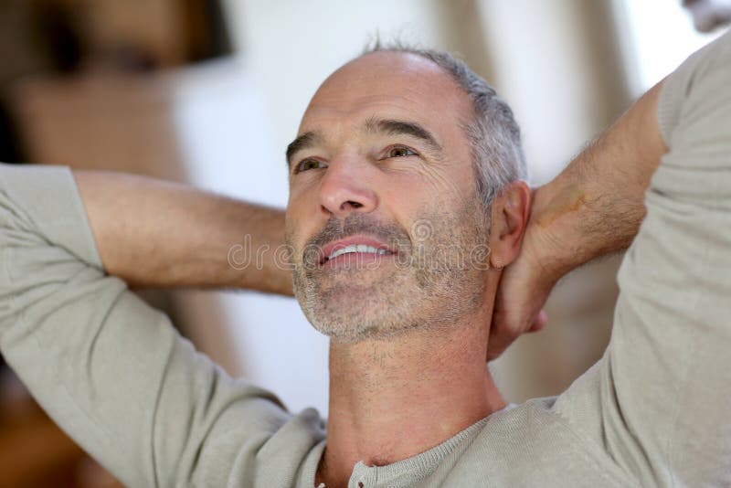 Senior Man Relaxing with Hands Behind Head Stock Photo - Image of ...