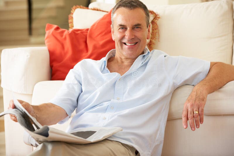 Senior Man Relaxing on Sofa Stock Image - Image of indoors, relaxed ...