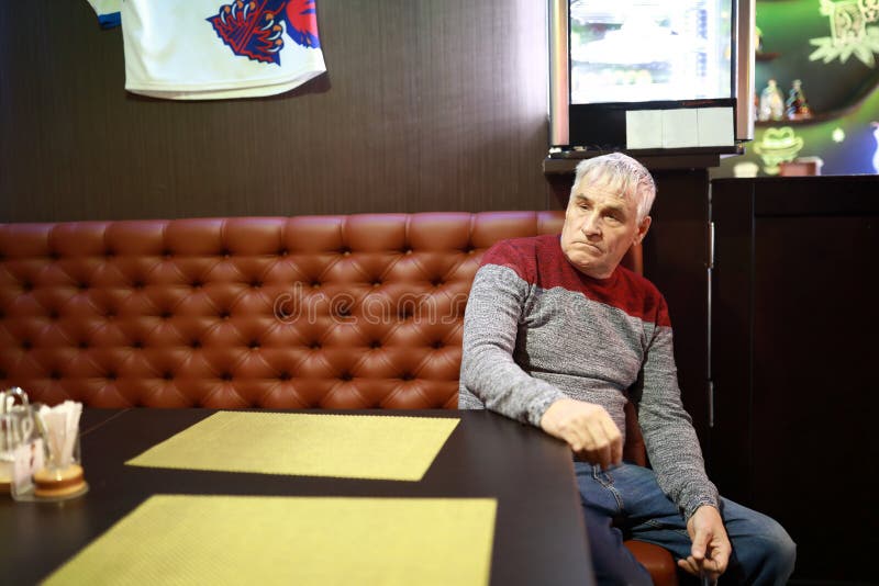 Senior man in restaurant stock image. Image of furniture - 131325889