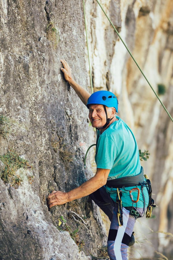 Senior Man with a Rope Climbing on the Rock Stock Photo - Image of ...