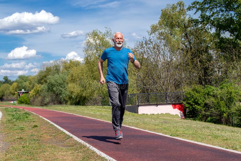 Senior Man Running on the Jogging Track on the Quay. Stock Photo ...