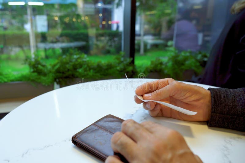 Senior Man& X27;s Hands Holding Order Receipt and Wallet Stock Photo ...