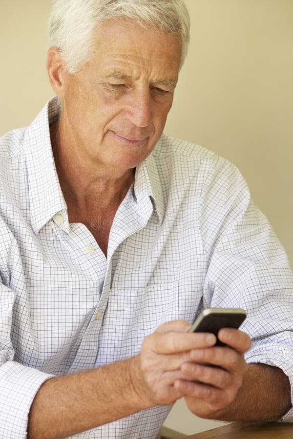 Senior Man Sending Text Message Sitting Sofa Stock Photos - Free ...