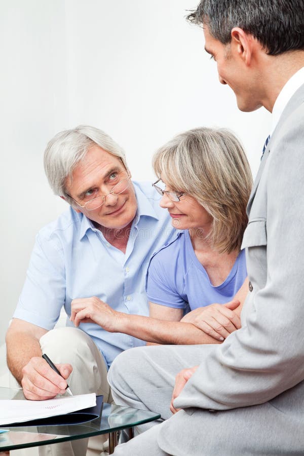 Senior Man Signing Contract Stock Image - Image of couple, broker: 23248893