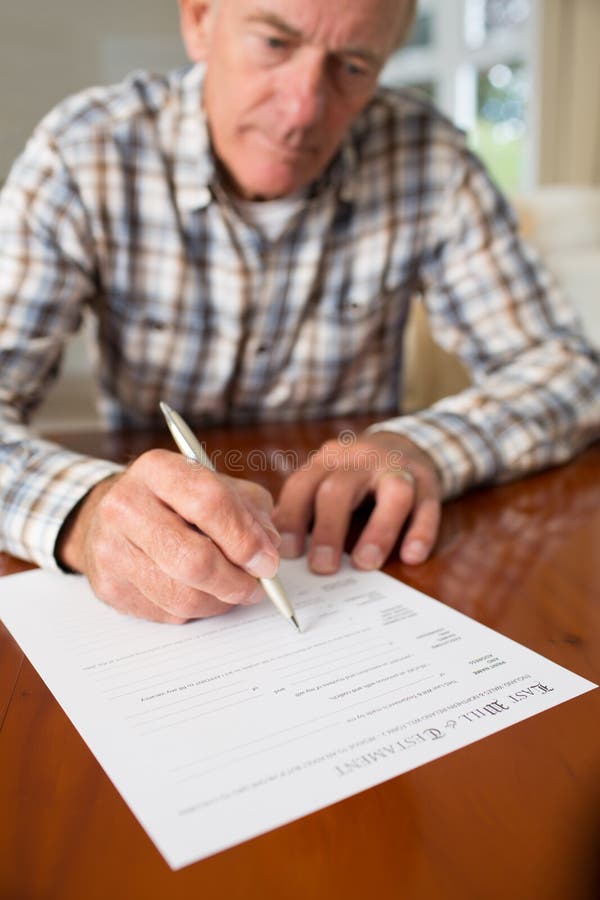 Senior Man Signing Last Will and Testament at Home Stock Photo - Image ...