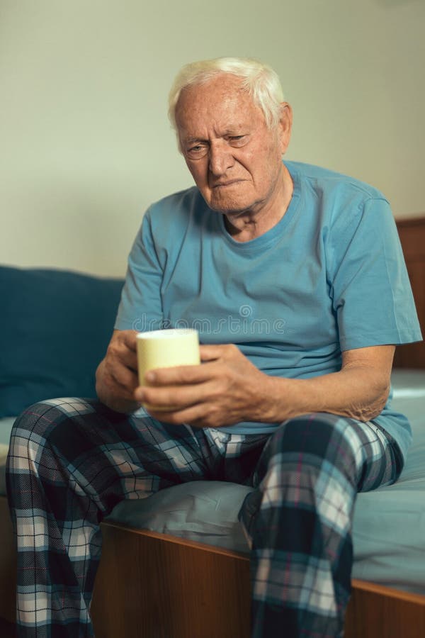 Senior Man Sitting on Bed Suffering from Depression Stock Photo - Image ... Senior Man Sitting on Bed Suffering from Depression Stock Photo - Image ...