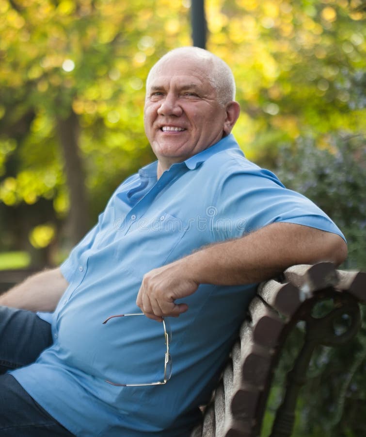 Senior Man Sitting on Bench Stock Photo - Image of happy, male: 51694206