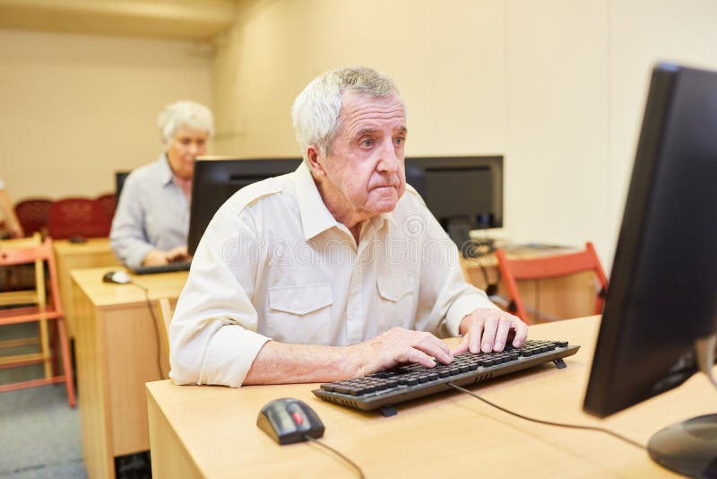 Senior Man Sitting on PC in a Computer Course Stock Photo - Image of ...